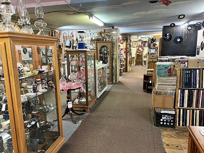 Where treasures meet: Display cases filled with delicate collectibles line pathways that beckon you deeper into this multi-level memory maze.