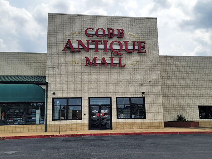 The unassuming exterior of Cobb Antique Mall hides a universe of treasures within. Like a time-travel portal disguised as a strip mall storefront.