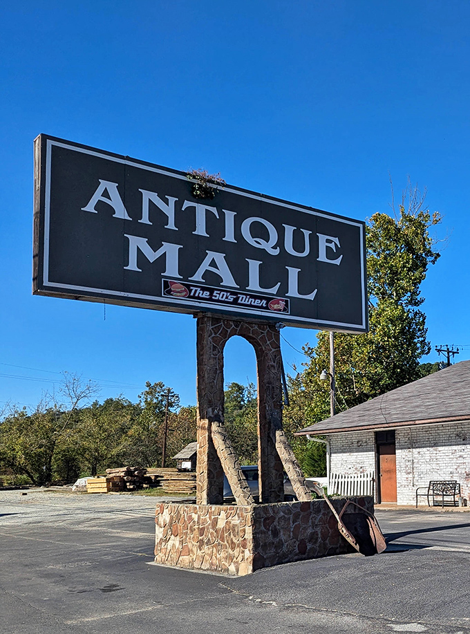 The iconic stone-based sign stands like a sentinel, promising treasures within. Against that perfect Tennessee blue sky, it's practically begging you to pull over.