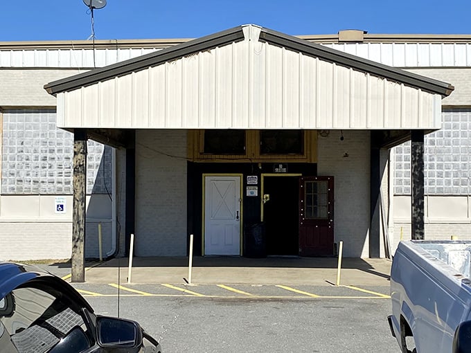 The unassuming exterior of Pine Crest Flea Market, where those festive balloons hint at the treasure trove waiting inside. 
