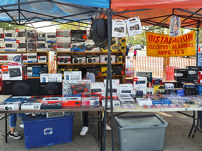 The electronics booth &ndash; where vintage car stereos and modern Bluetooth speakers coexist in a technological time warp that defies obsolescence.