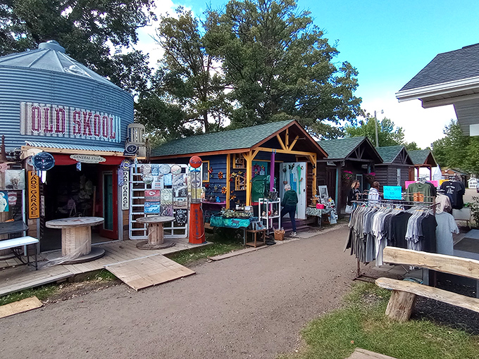 A treasure hunter's dream street! Colorful cabins line this rustic pathway, each one promising discoveries that big-box stores could never deliver.
