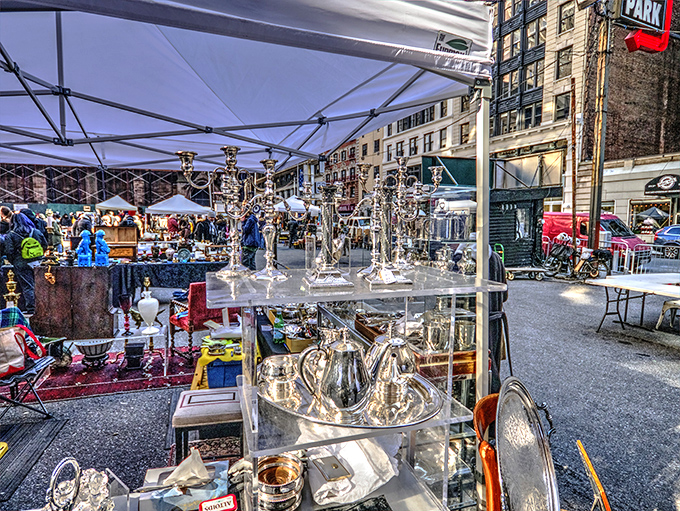 Silver treasures catching the morning light, where Manhattan's skyline serves as the perfect backdrop for vintage hunting adventures.