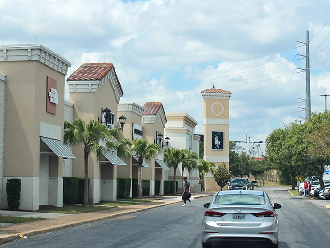 Mediterranean charm meets bargain hunting paradise. The palm-lined entrance to Orlando Outlet Marketplace promises retail therapy without the financial hangover.