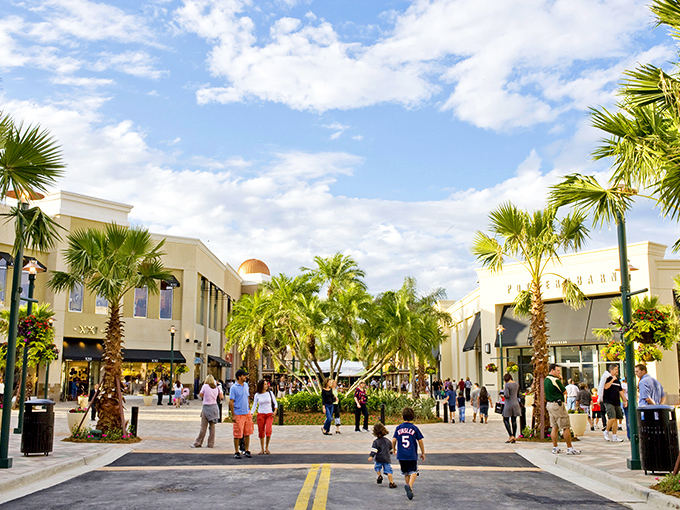 Palm trees stand sentinel over this Mediterranean-inspired plaza, where shopping feels less like a mission and more like a Florida vacation.