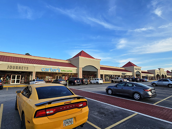 The iconic red-roofed wonderland of Tanger Outlets Locust Grove beckons shoppers like a retail oasis in the Georgia sun.