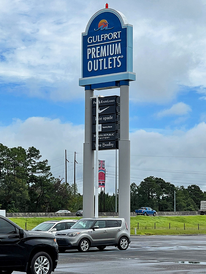 This towering sign isn't just giving directions&mdash;it's listing all the places your credit card is about to visit on its farewell tour.
