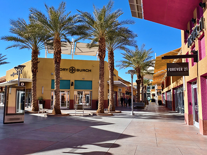 Palm trees frame the Tory Burch storefront, creating an oasis of luxury shopping where your wallet can actually relax a little.