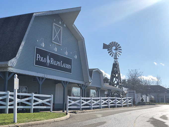 The iconic Polo Ralph Lauren barn-style storefront with its charming windmill stands as Aurora Farms' unofficial welcome committee.