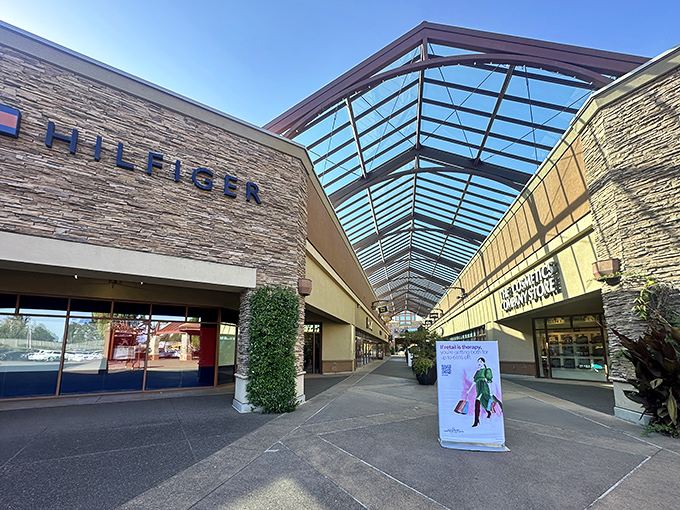 Tommy Hilfiger welcomes shoppers under Woodburn's signature skylit walkways, where retail therapy meets architectural elegance.