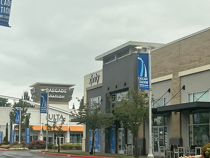 Retail therapy paradise in Portland. This bustling outlet entices shoppers with endless deals, framed by the mall&rsquo;s storefront and a tree standing gracefully at its side.