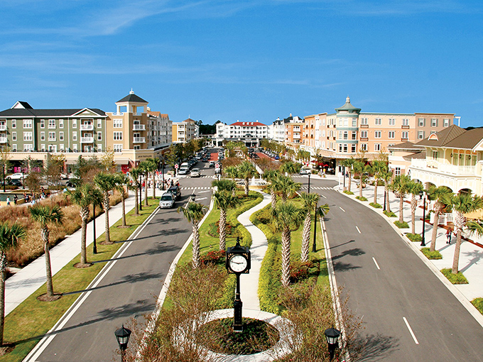 Palm-lined boulevards and pastel buildings create a Main Street USA vibe that makes shopping feel like you're wandering through a movie set.