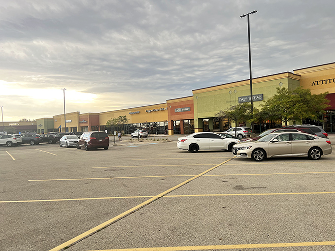 The sprawling exterior of Johnson Creek Premium Outlets basks in Wisconsin sunshine, a retail oasis promising treasures for those brave enough to hunt.