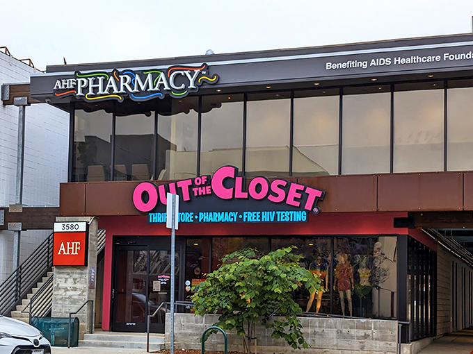 The iconic pink signage of Out of the Closet beckons like a neon promise of treasures waiting to be discovered inside.