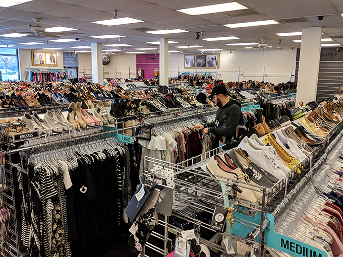 Fashion jungle or organized paradise? Rows upon rows of carefully categorized clothing create a secondhand wonderland where budget meets style.