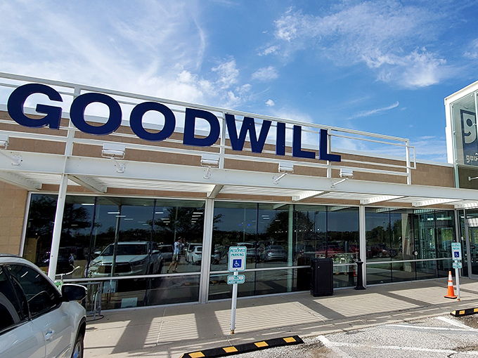 Bold blue letters against clear skies &ndash; Goodwill's entrance promises treasure hunting adventures that won't require a second mortgage or buyer's remorse.