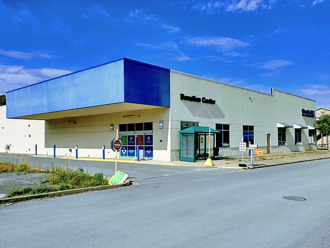 The blue-accented exterior of Goodwill in Morgantown stands like a treasure chest waiting to be opened&mdash;where bargain hunting adventures begin and wallets breathe sighs of relief.