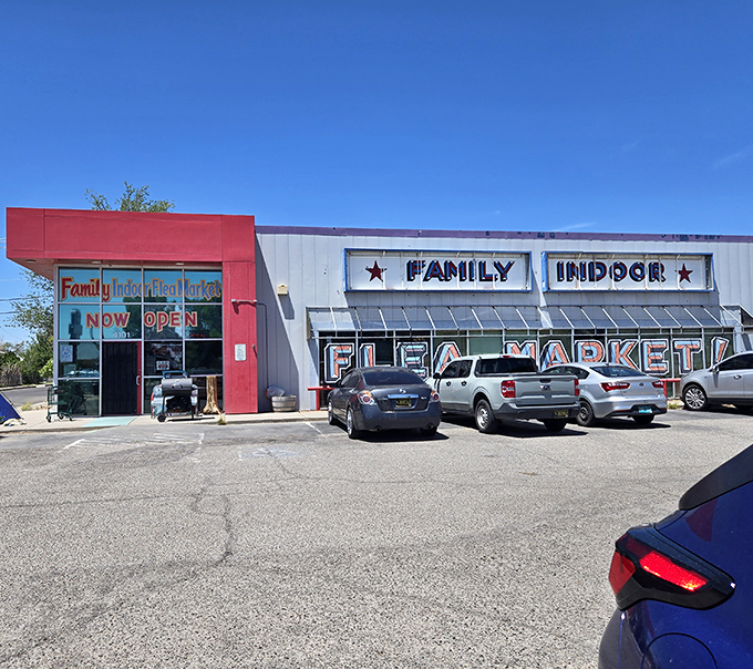The red and silver exterior of Family Indoor Flea Market stands like a treasure chest in the Albuquerque sun, promising adventures in vintage hunting within.