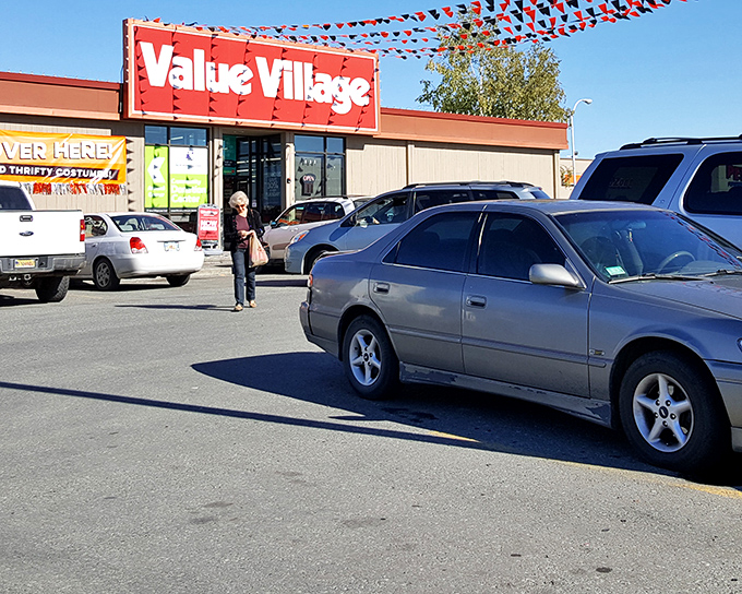 The iconic red sign of Value Village beckons like a lighthouse to bargain hunters, promising treasures that won't break the bank.