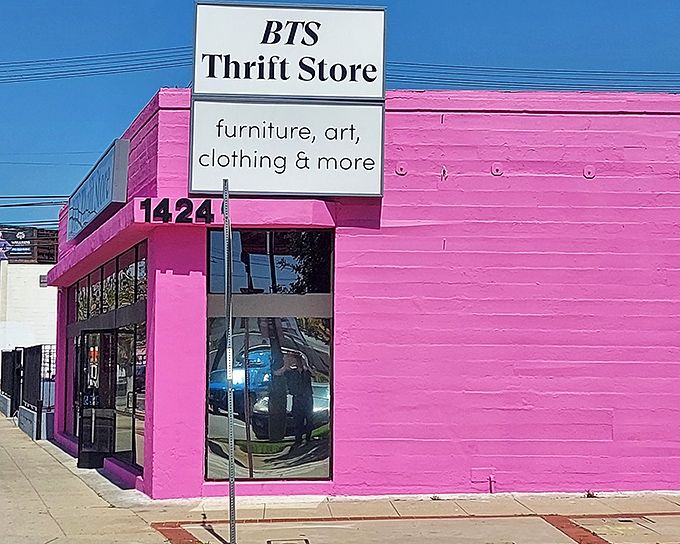 The unmistakable hot pink exterior of BTS Thrift Store stands out like a flamingo in Los Angeles, beckoning treasure hunters with its vibrant promise of discoveries within.