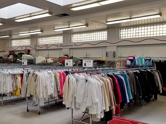 The clothing racks at Goodwill's Concord location stretch like an endless sea of fashion possibilities, where yesterday's trends await their second act.