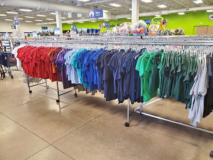 Color-coded clothing racks stretch like a rainbow highway through the store, promising fashion treasures for the patient hunter.