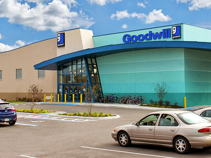 The turquoise and tan exterior of Goodwill Trinity isn't just eye-catching—it's a beacon for bargain hunters with champagne taste on a root beer budget.