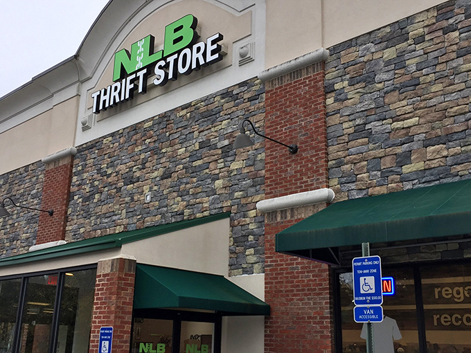 The stone facade and bright green signage of NLB Thrift Store stands out like a beacon for bargain hunters in Woodstock. Those green awnings practically whisper, "Treasures inside!"