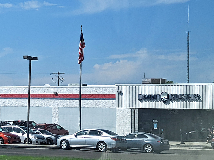 The bright white facade of Deseret Industries, with its bold red and blue stripe, shines beneath Idaho&rsquo;s wide-open blue sky&mdash;a true beacon for thrift lovers.