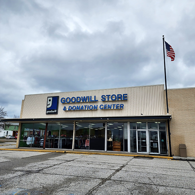 Blue signage beckons like a retail lighthouse, guiding budget-conscious shoppers to a harbor of possibilities where yesterday's castoffs become tomorrow's conversation pieces.