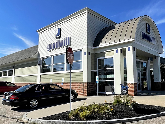 The distinctive curved-roof Goodwill in Portsmouth stands like a beacon for bargain hunters, promising treasures within its unassuming exterior.