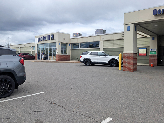 The Manchester Goodwill stands proud against New Hampshire skies, a modern-day treasure chest where bargain hunters strike gold without breaking the bank.