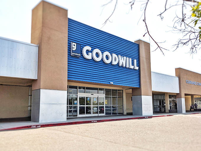 The iconic blue facade of Goodwill on San Mateo Boulevard stands like a beacon of bargain possibilities, promising treasures waiting to be discovered inside.