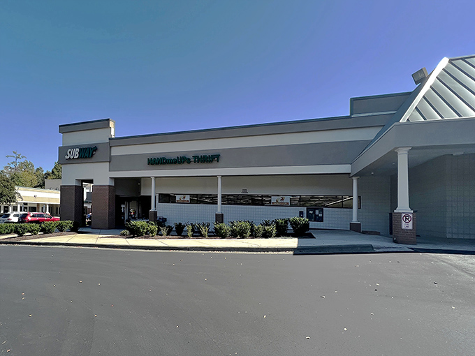The unassuming exterior of HandmeUPs Thrift stands like a vault of hidden treasures waiting to be discovered by savvy Raleigh shoppers.