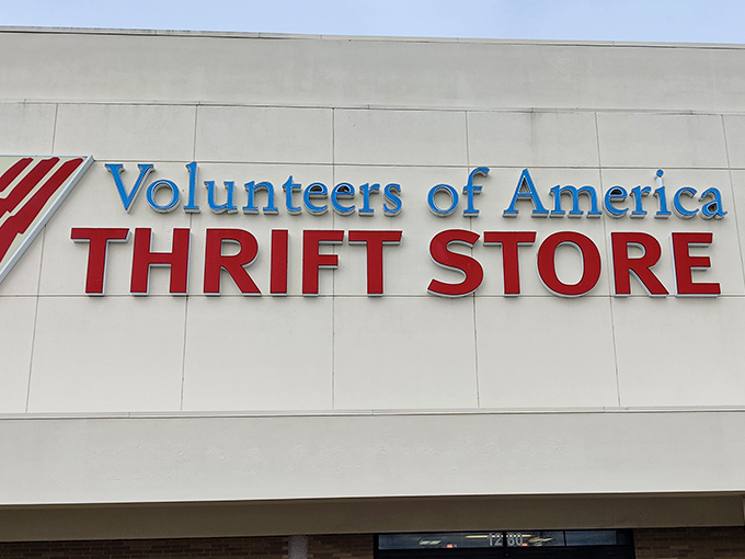 Bold blue letters against crisp white &ndash; the thrift store's fa&ccedil;ade promises treasures within, no password required.