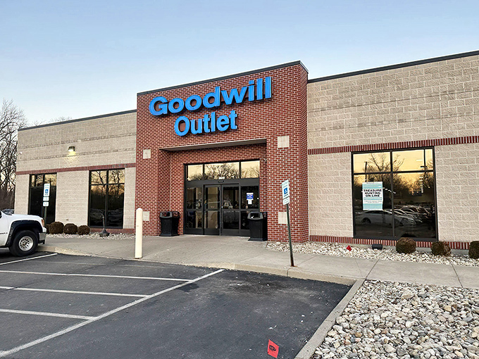 The unassuming brick facade of Goodwill Outlet on Woodman Drive hides a treasure hunter's paradise within. Like a secondhand Narnia, this is where bargain adventures begin.