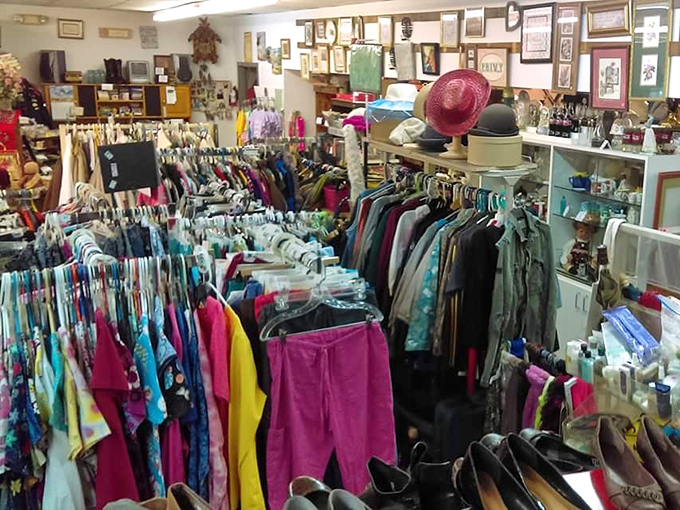 A rainbow explosion of clothing racks that would make Marie Kondo simultaneously faint and rejoice. Every hanger holds a potential fashion resurrection story.