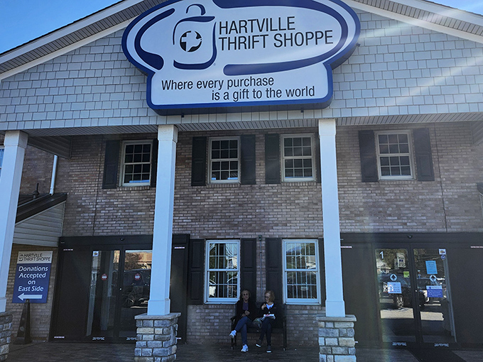 The welcoming facade of Hartville Thrift Shoppe promises treasure hunting adventures within. That sign isn't kidding&mdash;every purchase really does give twice.