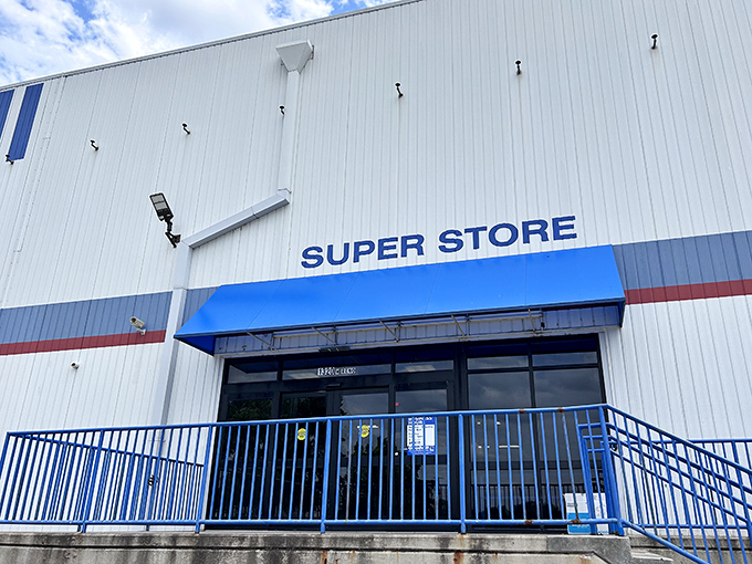 The unassuming exterior of Goodwill's "Super Store" is like a treasure chest disguised as a warehouse. Adventure awaits behind those blue awnings!