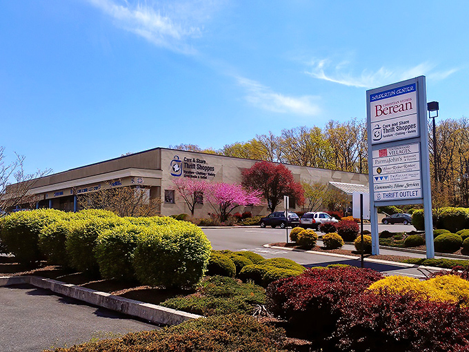 The unassuming exterior of Care & Share belies the treasure trove within. Spring blossoms add a cheerful welcome to bargain hunters.