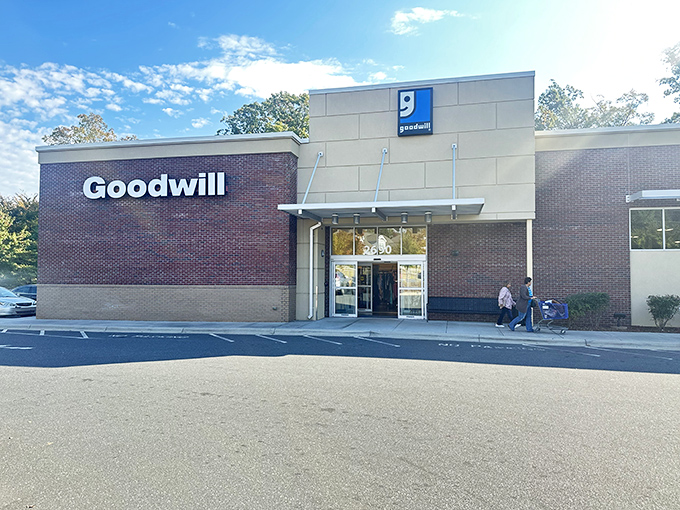The Fort Mill Goodwill welcomes bargain hunters with its clean brick facade and promise of treasures within. No fancy frills needed when adventure awaits inside.