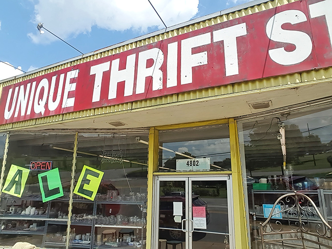 The iconic red and yellow signage of Unique Thrift Store beckons bargain hunters like a lighthouse for the fiscally responsible shopper.