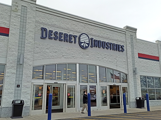 The iconic white facade of Deseret Industries in Murray stands like a beacon of bargain possibilities, promising treasures waiting to be discovered inside.