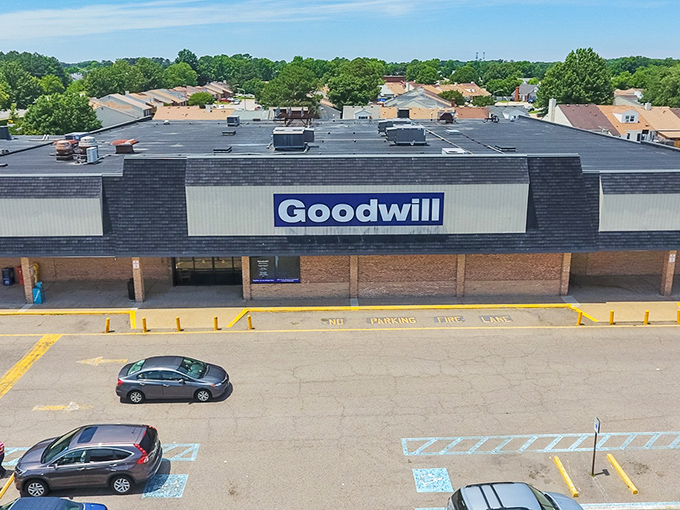 From above, this Goodwill kingdom stretches like a bargain hunter's promised land, its blue sign beckoning treasure seekers from across Virginia Beach's suburban landscape.