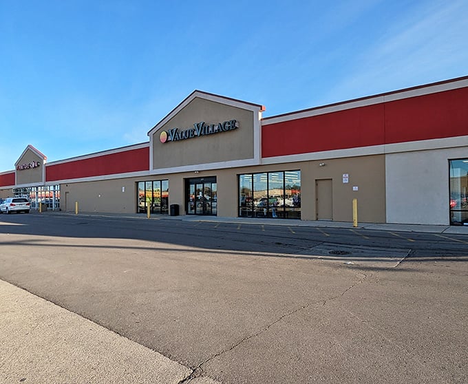 A wider view of Value Village's exterior showcases its prominent signage against the bright blue Racine sky.