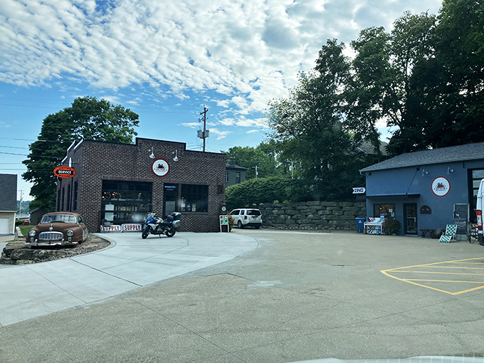 Two buildings, one story: the brick and blue structures of Antique Archaeology stand ready to welcome treasure hunters from across America's heartland.
