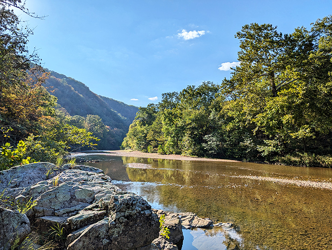 The St. Francis River bends gracefully between ancient mountains, creating a postcard-worthy scene that Instagram filters couldn't improve if they tried.
