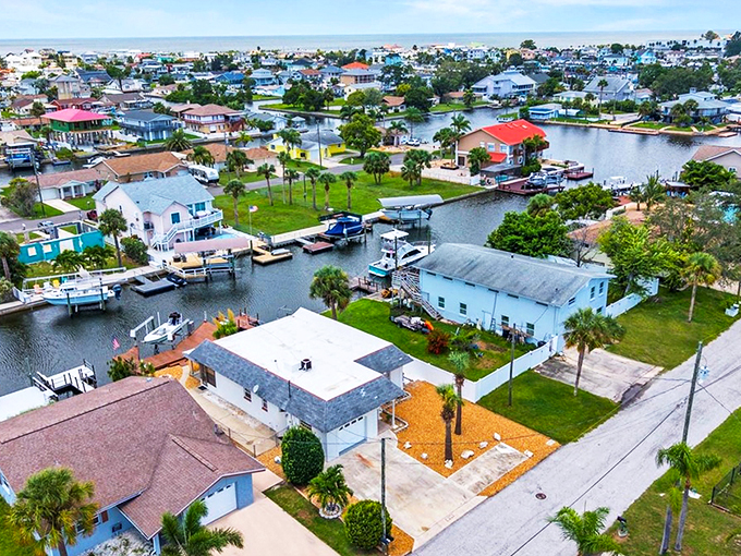 The intricate canal system transforms ordinary backyards into private boat launches, where your morning commute involves dolphins rather than traffic.