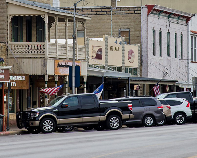 Historic storefronts along Main Street showcase Fredericksburg's German heritage with their distinctive limestone facades and charming wooden balconies.