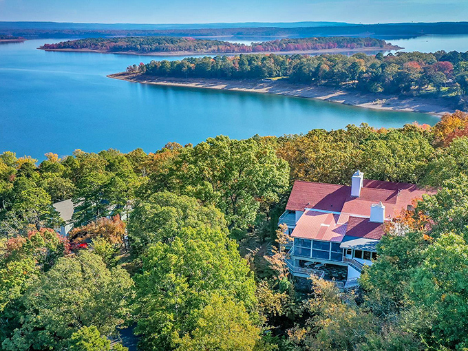 Greers Ferry Lake stretches like a sapphire blanket beneath the Ozark hills, where waterfront homes offer million-dollar views at small-town prices.
